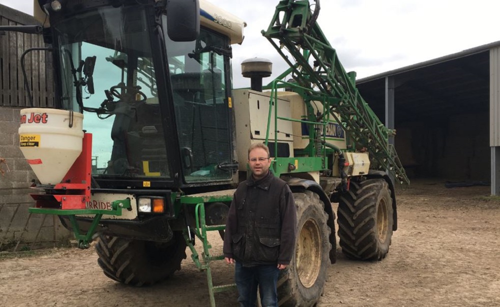 Brigg Monitor Farm host Colin Chappell next to a sprayer | AHDB